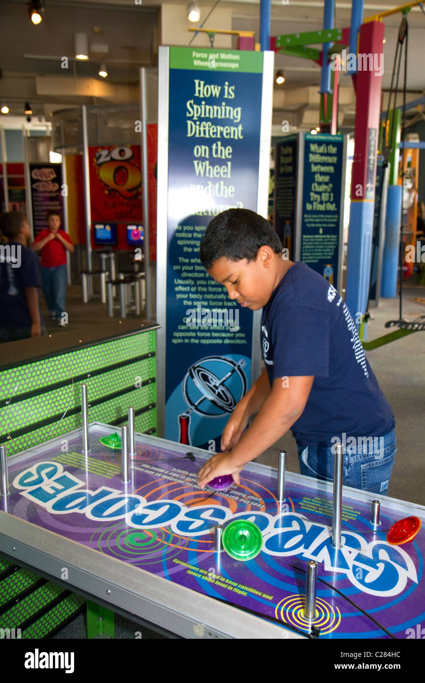 Boy using an interactive exhibit at the Gulf Coast Exploreum Science ...