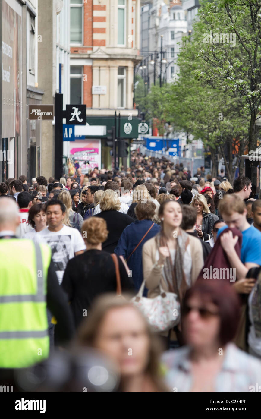 Crowds of shoppers fill Oxford Street, London, UK, creating a bustling ...