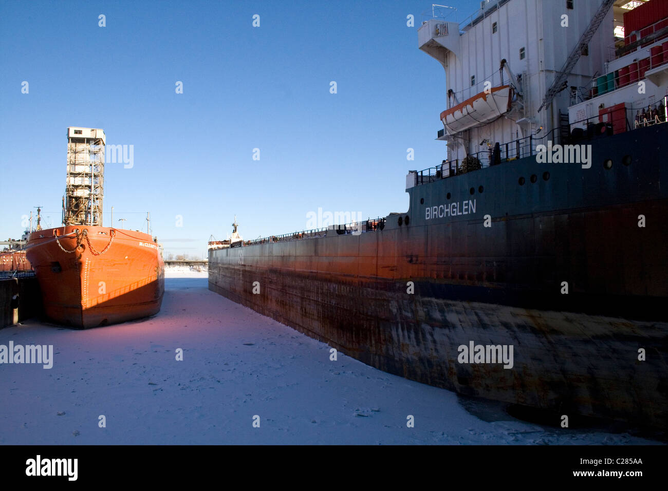Port side of cargo ship Birchglen docked in frozen harbour, Montreal ...