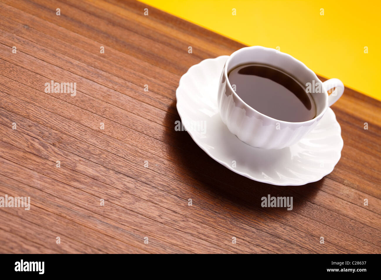 Hot tea over yellow background Stock Photo - Alamy