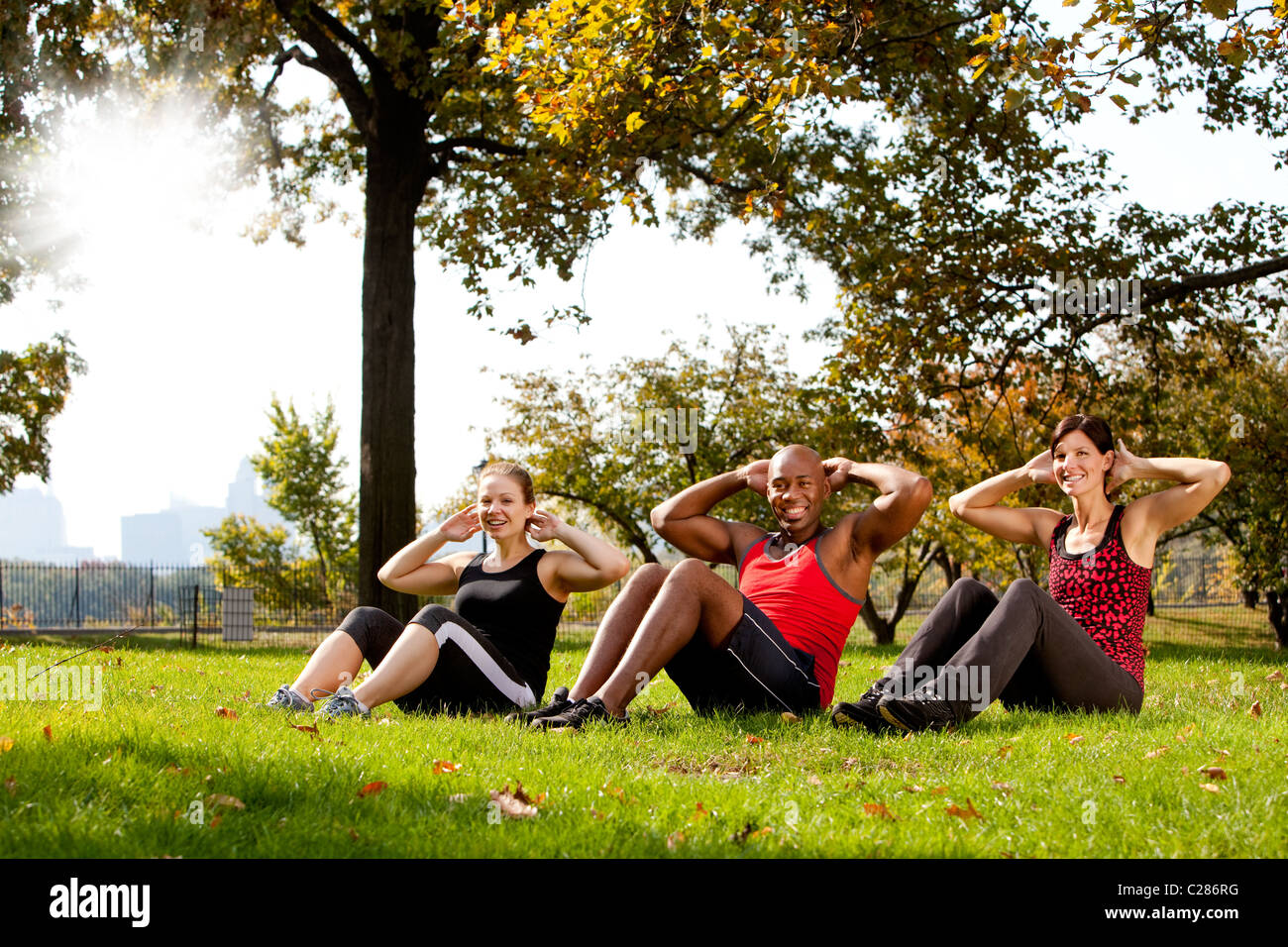A group of people doing exercises in the park Stock Photo - Alamy