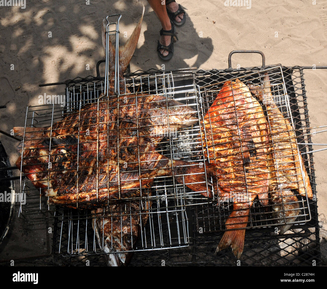 Red Snapper fish cooking on a barbecue Stock Photo - Alamy