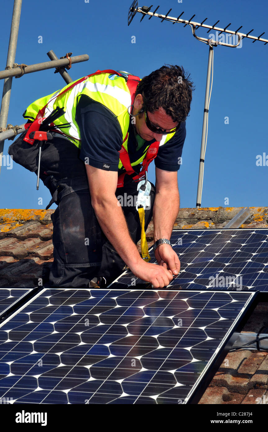 Solar panels being installed on a house roof, Britain, UK Stock Photo ...