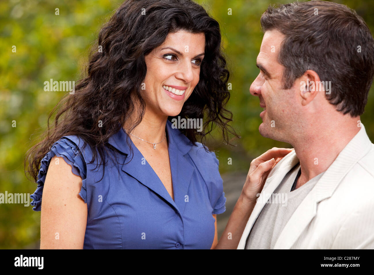 A woman looking happy at her husband / boyfriend - Focus on the woman ...