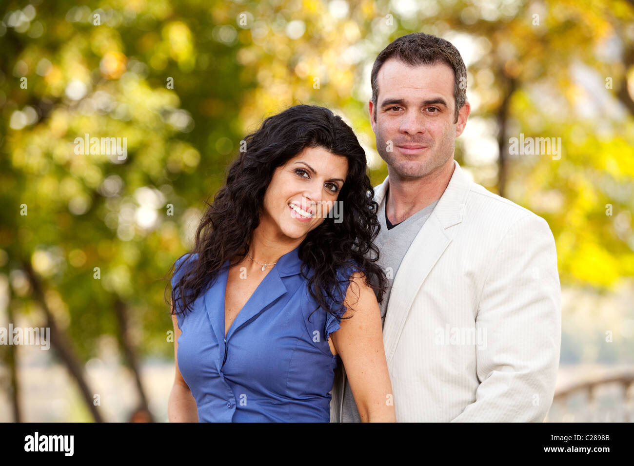 A portrait of a happy male and female in a park Stock Photo - Alamy