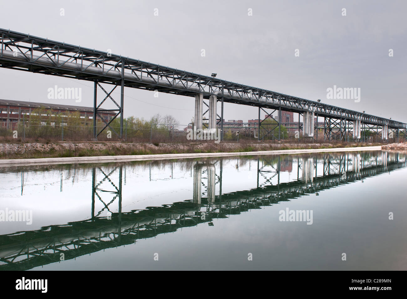 an elevated pipe in an industrial area Stock Photo - Alamy
