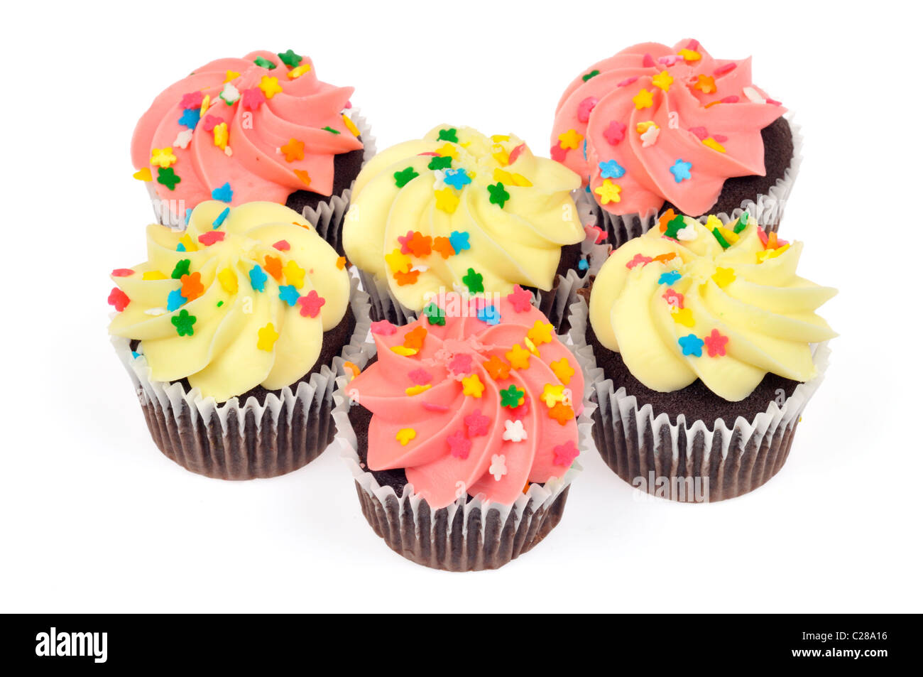 Group of many chocolate cupcakes decorated with yellow lemon and pink ...