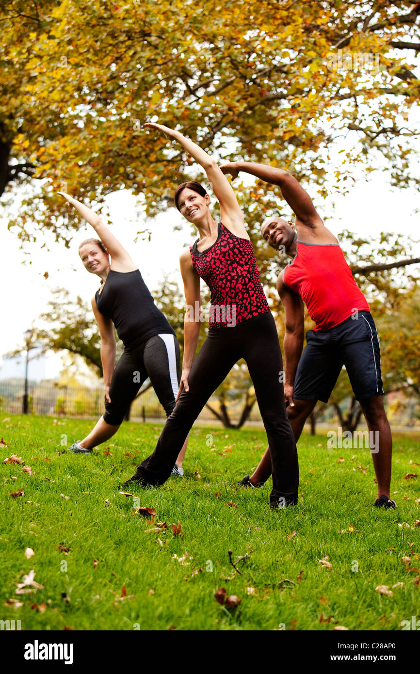 A group of people exercising in a park Stock Photo - Alamy