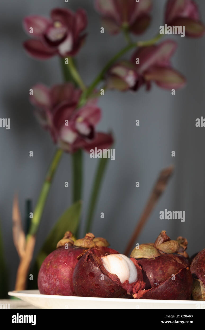 Natural Home Decor with Fruits and Purple Orchids Stock Photo - Alamy