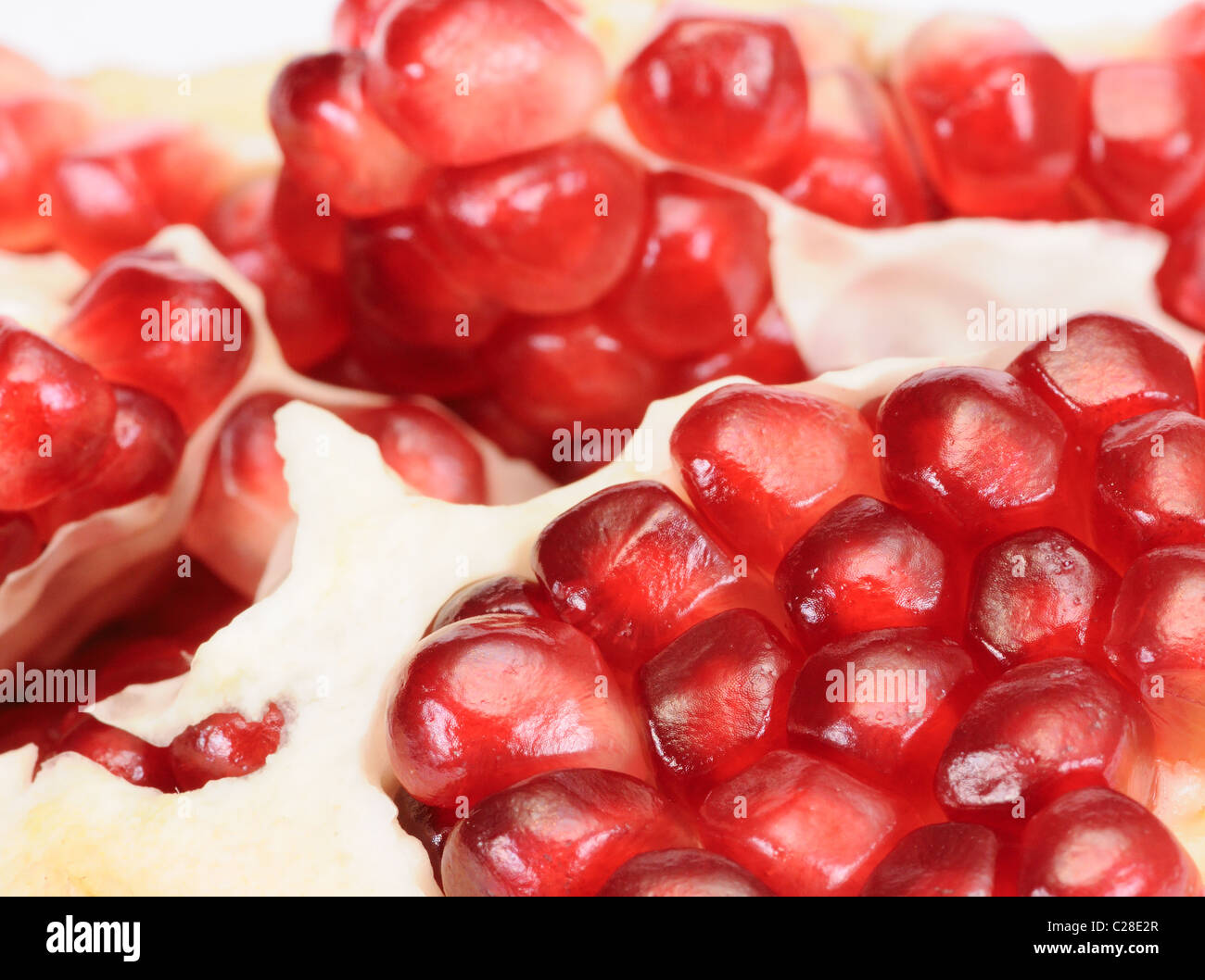 Pomegranate grains in a plate shot close-up Stock Photo - Alamy