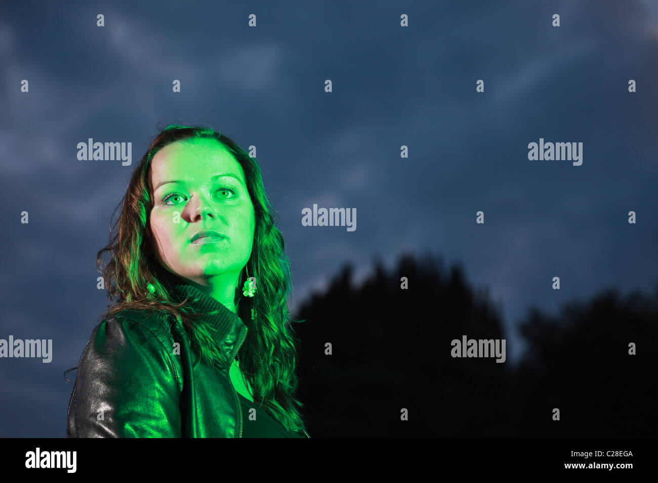 Person shining a light at the night sky hi-res stock photography and ...