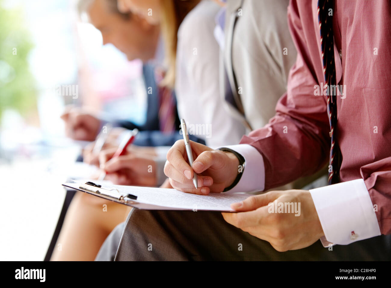 Human hand over paper making notes in working environment Stock Photo ...