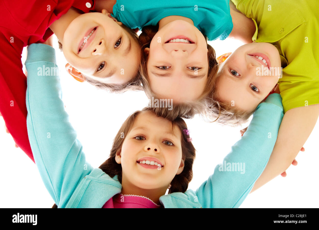 Team of happy kids embracing together Stock Photo - Alamy