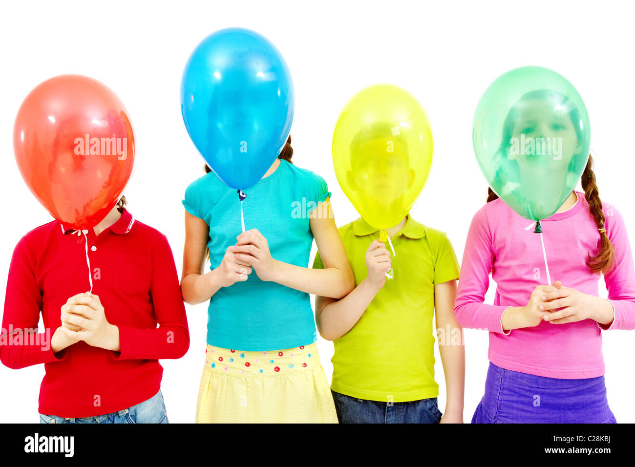 Image of children holding colorful balloons opposite their face Stock ...