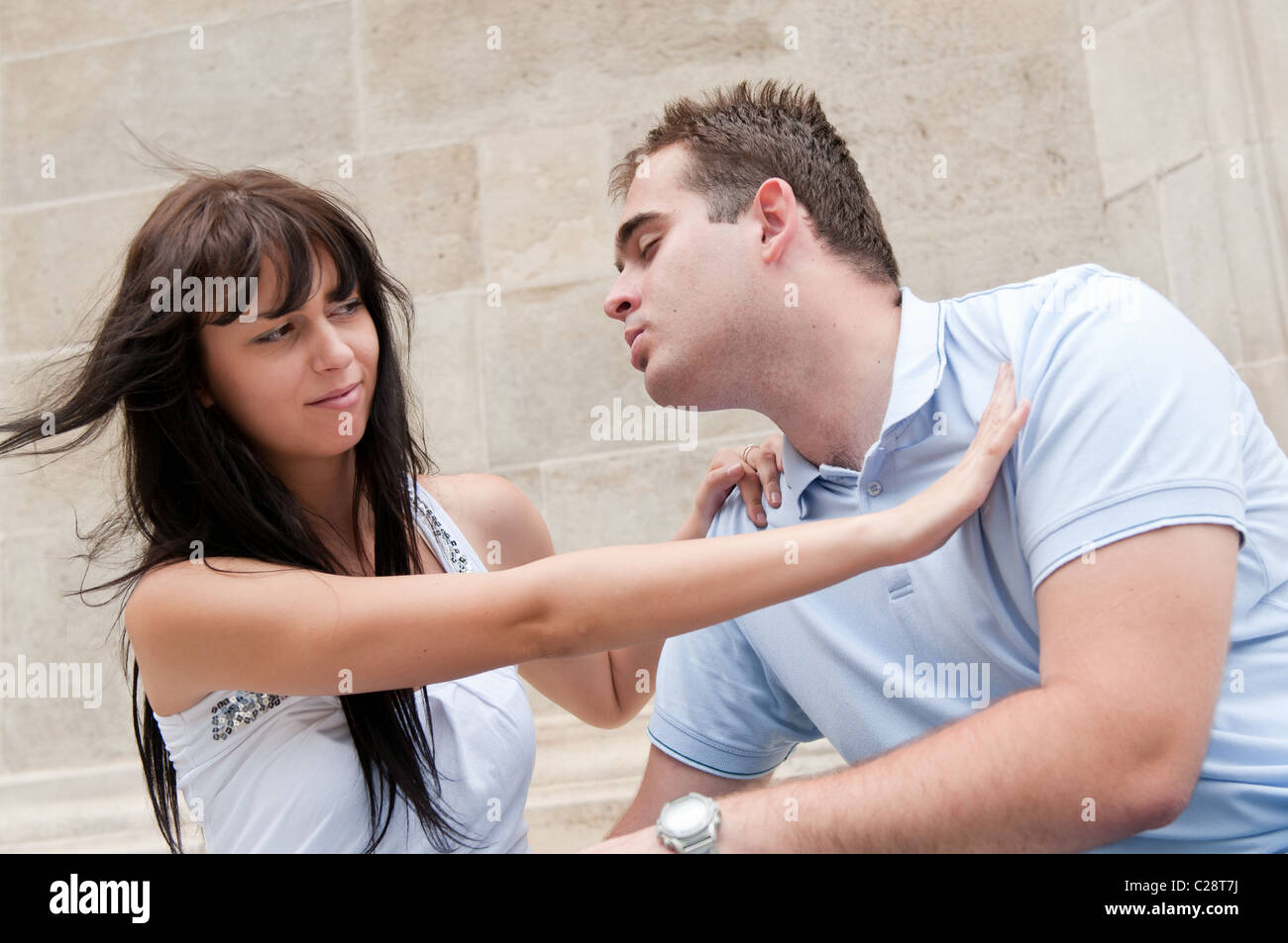 Young couple having relationship problems - woman refuses kissing from ...