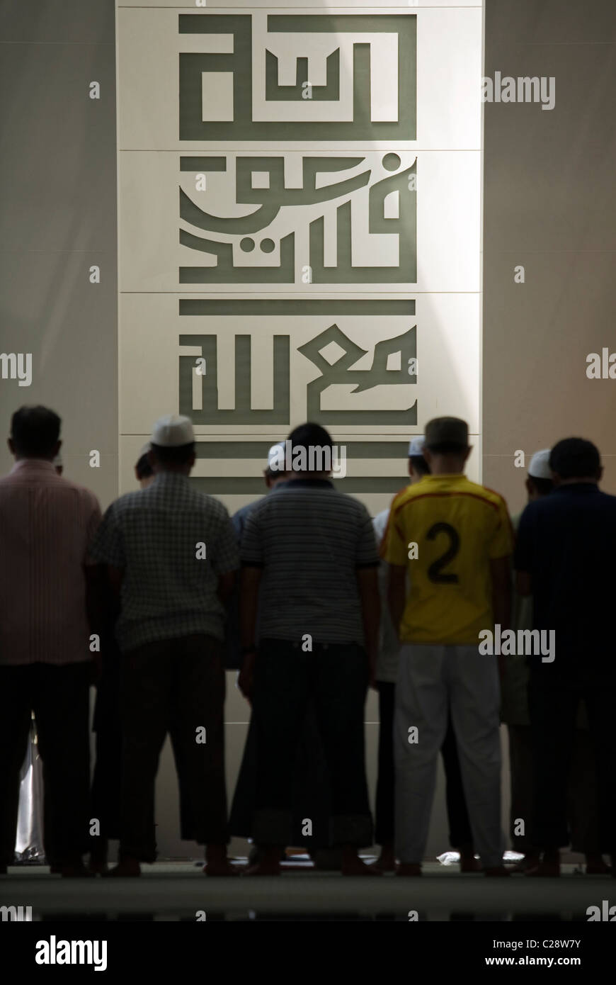Men pray in the main prayer hall at the Assyafaah Mosque in Singapore ...