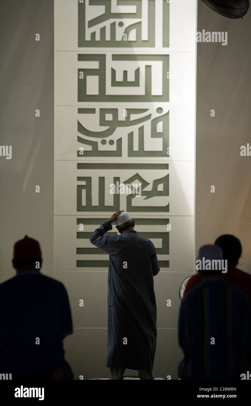 A man prays in the main prayer hall at the Assyafaah Mosque in ...