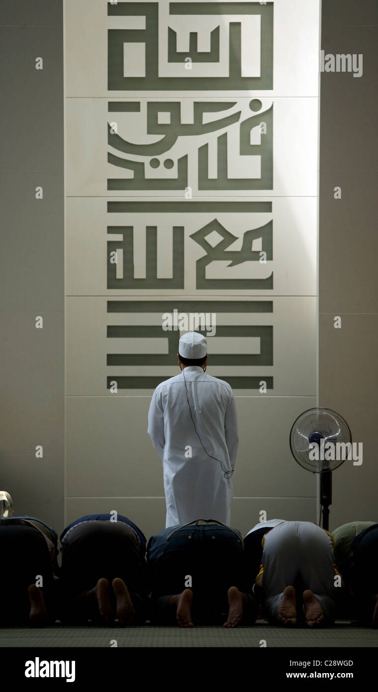 An Imam leads prayers in the main prayer hall at the Assyafaah Mosque ...