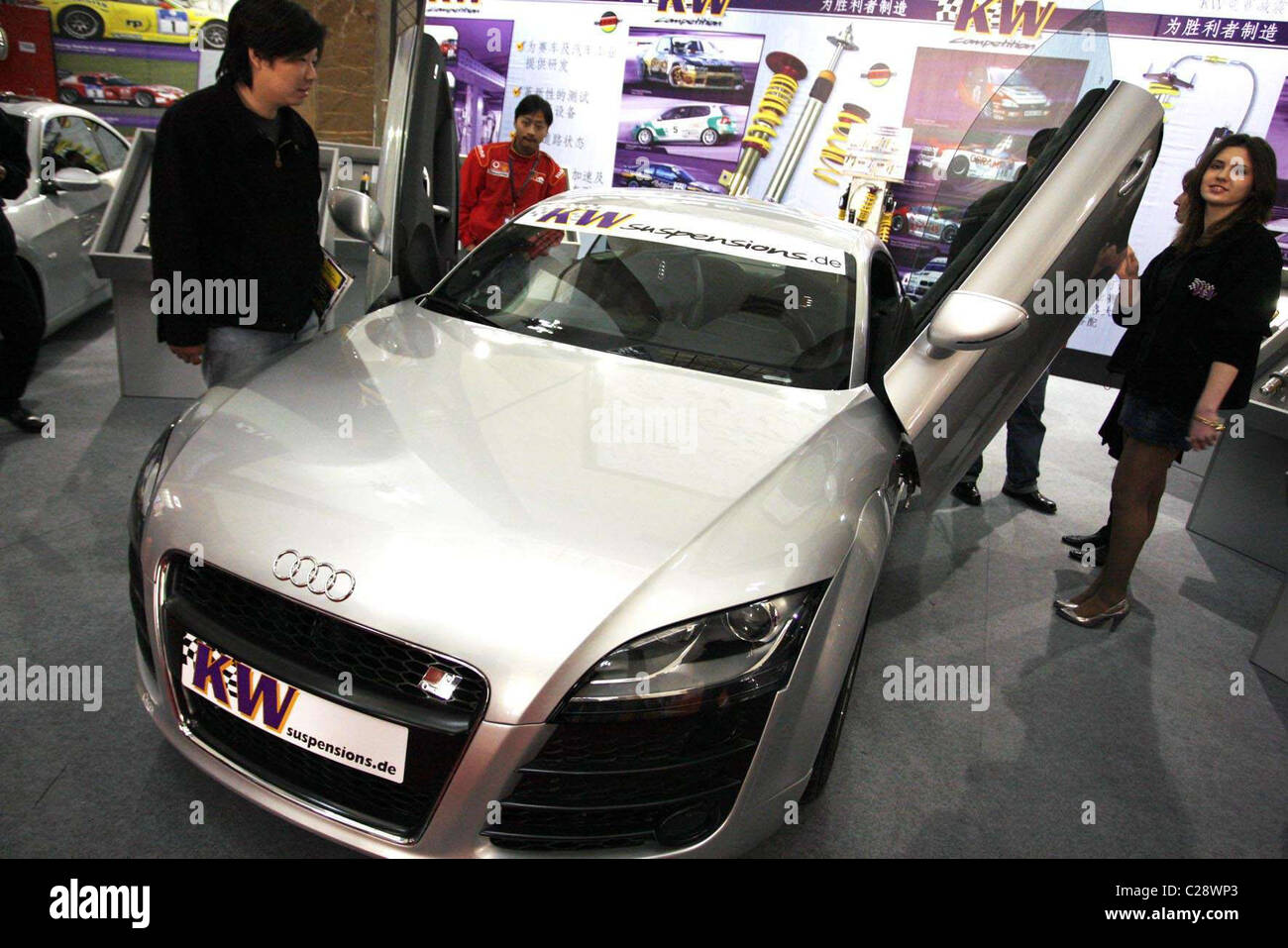 Petrol-heads admire a display of modified cars in Beijing, China ...