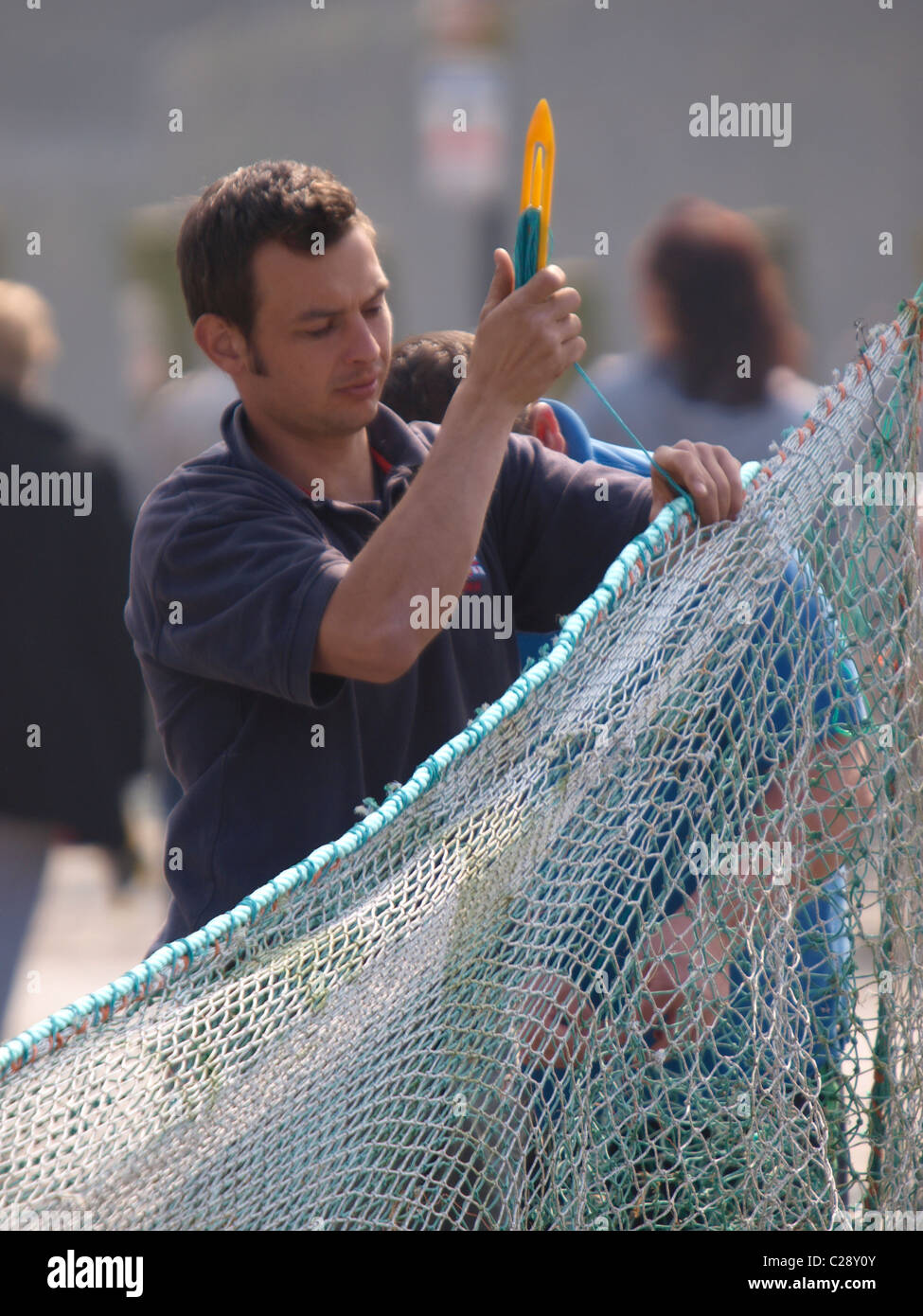 Repairing nets hi-res stock photography and images - Alamy
