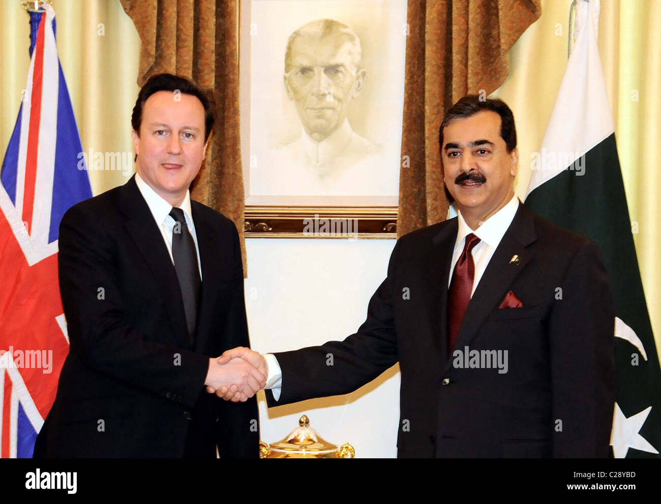 Prime Minister, Syed Yousuf Raza Gilani shakes hands with his British ...