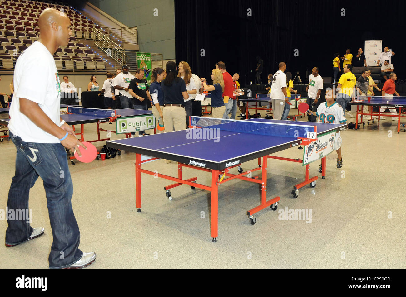 Jason Taylor plays ping pong with his son during the Jason Taylor ...