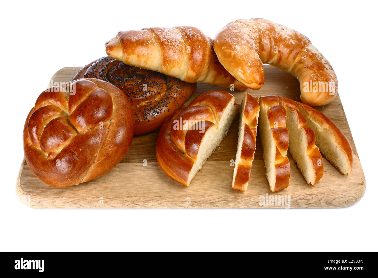 bread on a board isolated on white background Stock Photo - Alamy