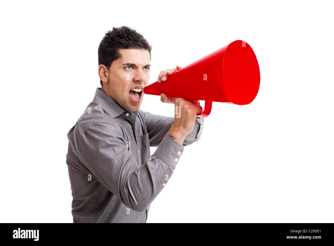 Young man shouting into a megaphone over a white background Stock Photo ...