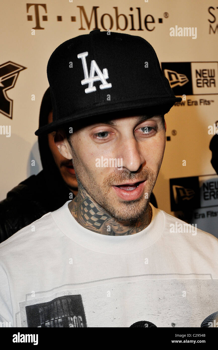 Travis Barker arrives at the famous stars & straps 10th anniversary and ...