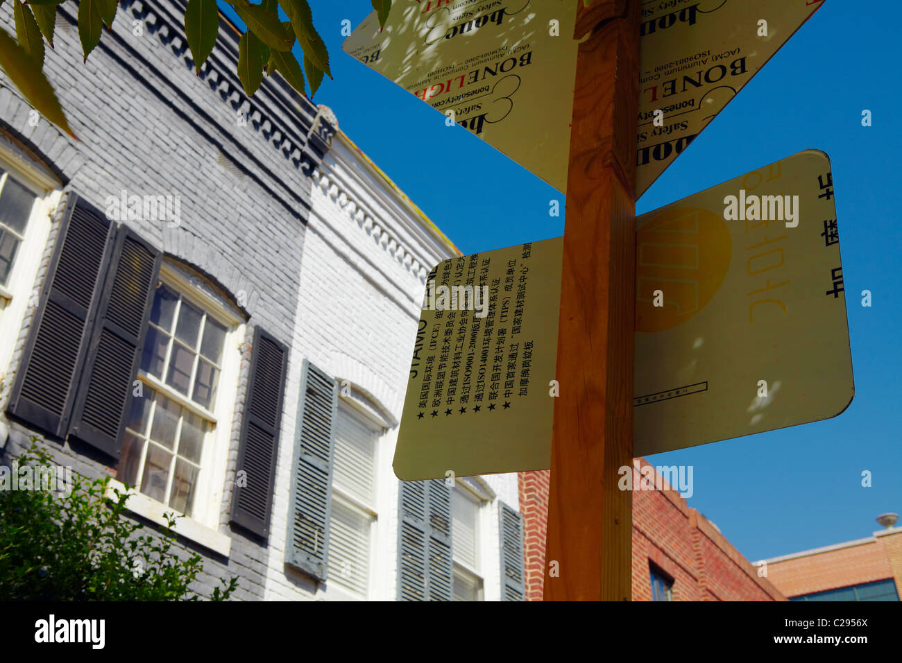Chinese characters cover the back of a Pedestrian Crossing sign in the ...