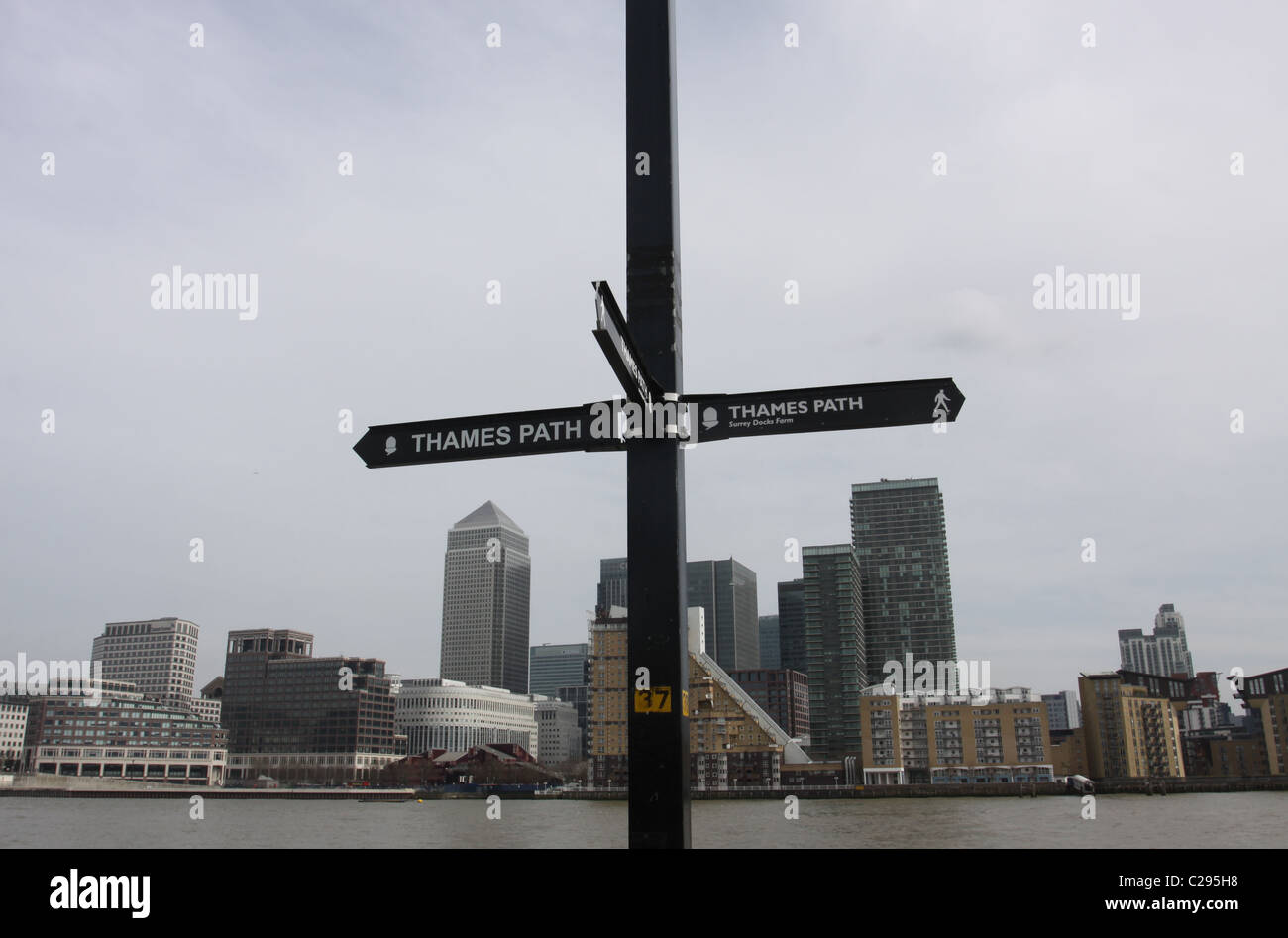 Thames Path signpost and Docklands skyline London England April 2011 ...