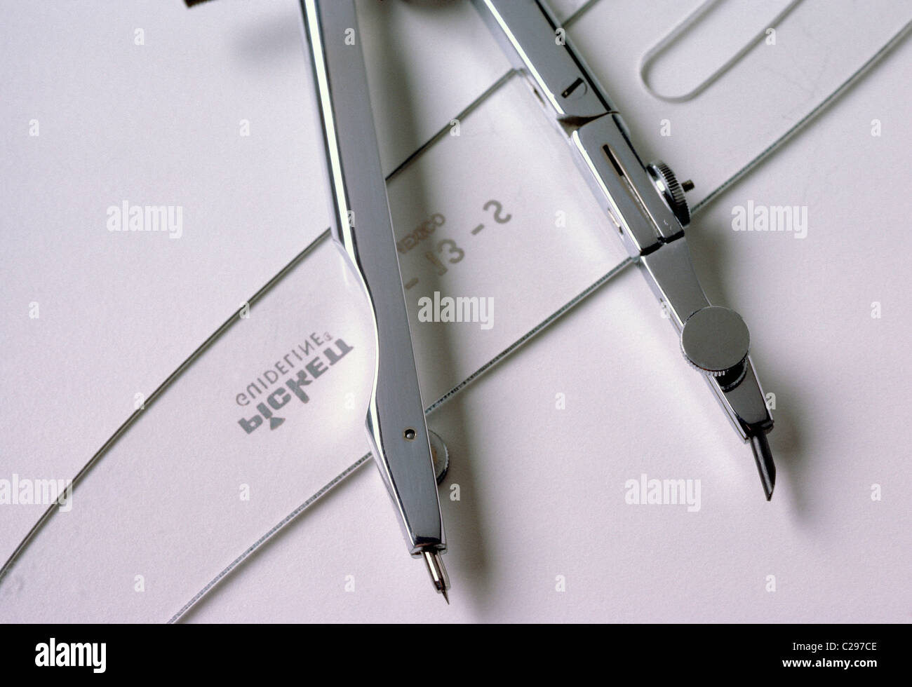 Close up of drawing compass and French Curve Stock Photo - Alamy