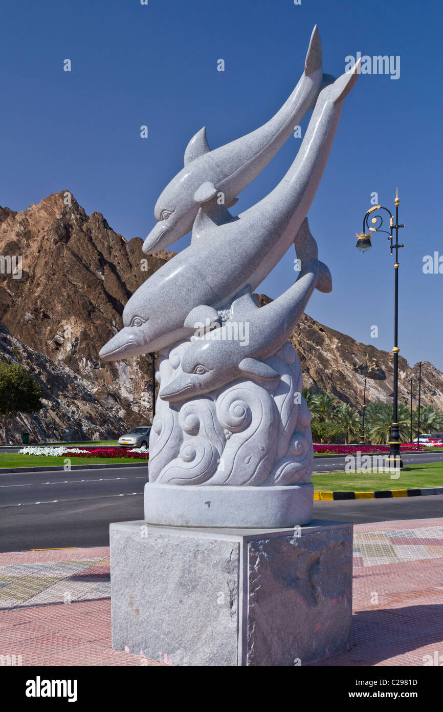 Aquatic dolphin sculptures on the Corniche promenade in Muscat, Oman ...