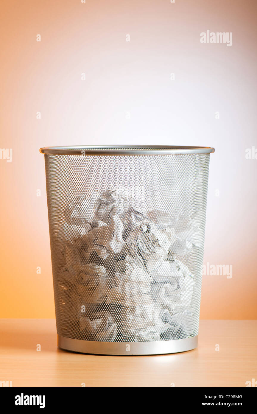 Garbage bin with paper waste isolated on white Stock Photo - Alamy