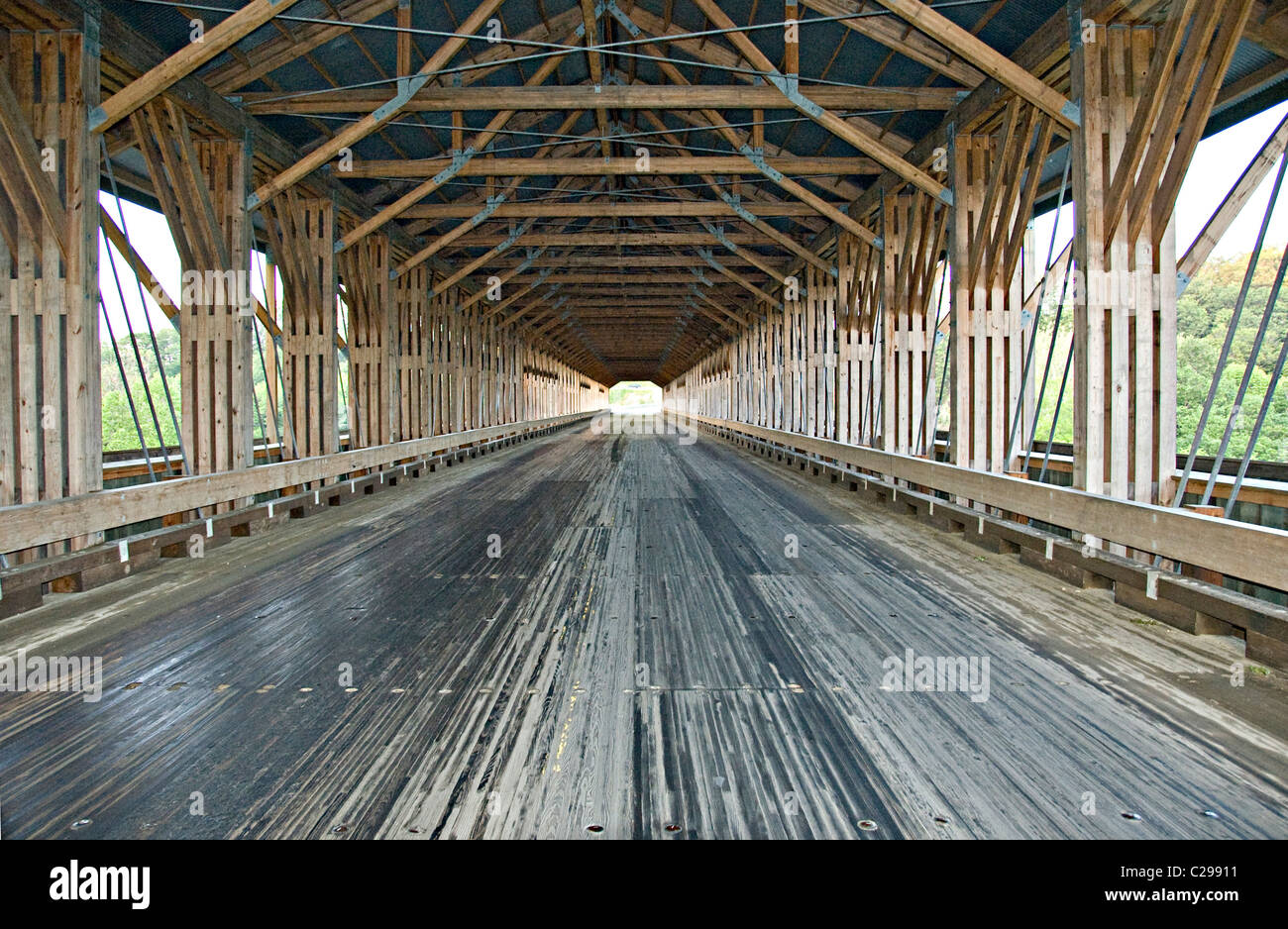 Straight-on view of inside of a long covered bridge Stock Photo - Alamy