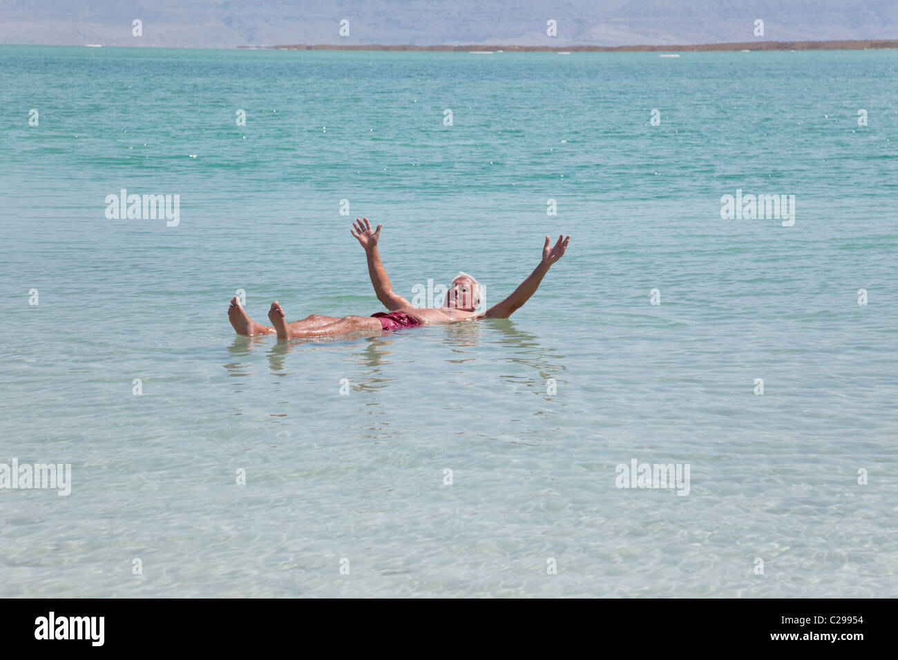 Senior man happy float effortlessly on the dead sea water Stock Photo ...