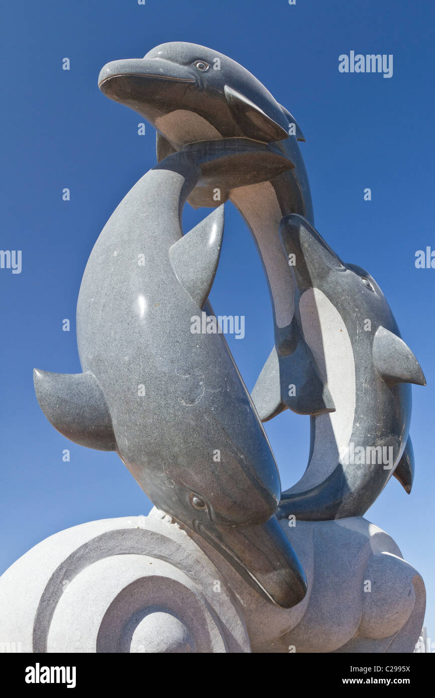 Aquatic dolphin sculptures on the Corniche promenade in Muscat, Oman ...