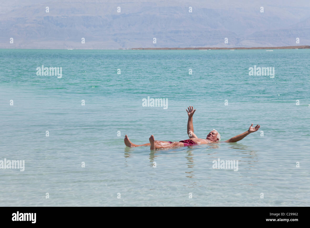 Senior man happy float effortlessly on the dead sea water Stock Photo ...