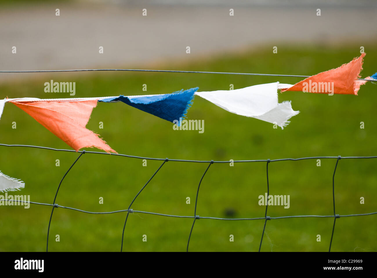 Flag bunting flapping in the wind at a village fete Stock Photo - Alamy