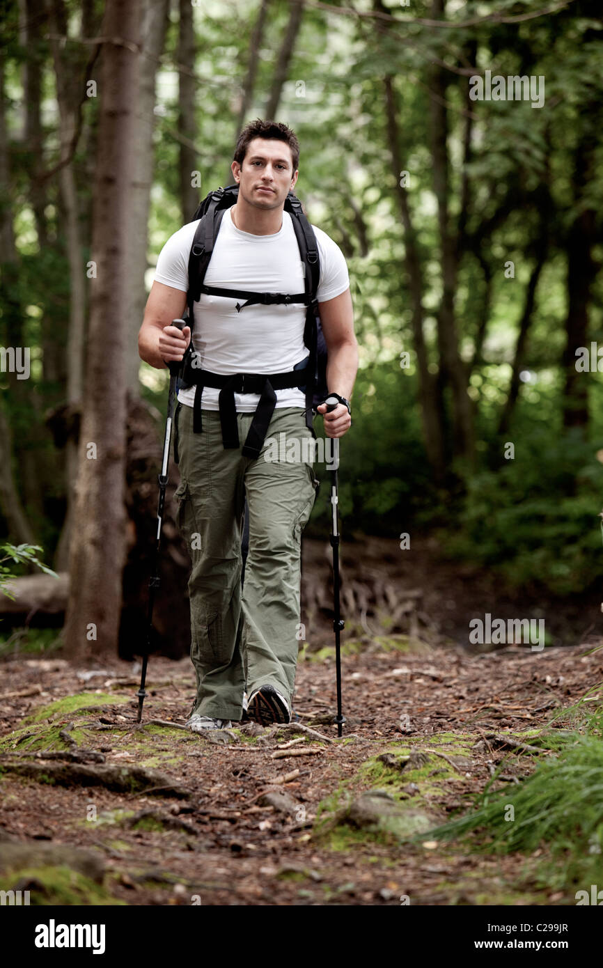 A male backpacking in the forest on a camping trip Stock Photo - Alamy