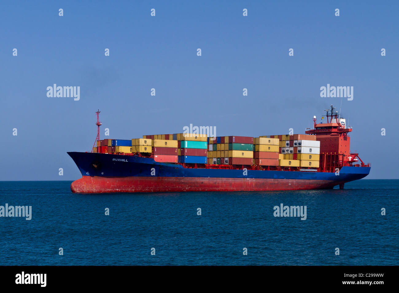 A container ship entering Port Sultan Qaboos in Muscat, Oman Stock ...