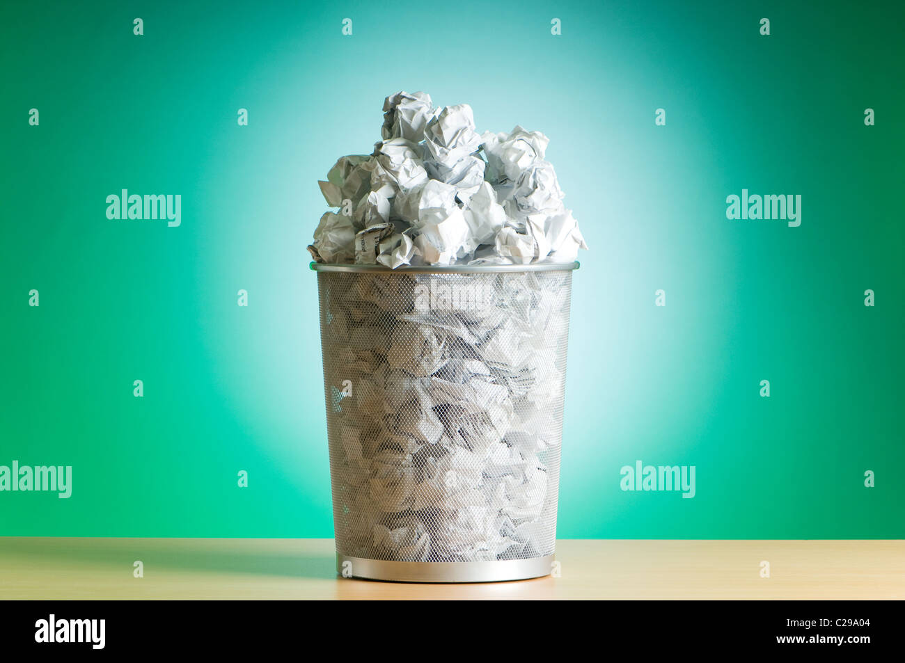 Garbage bin with paper waste isolated on white Stock Photo - Alamy