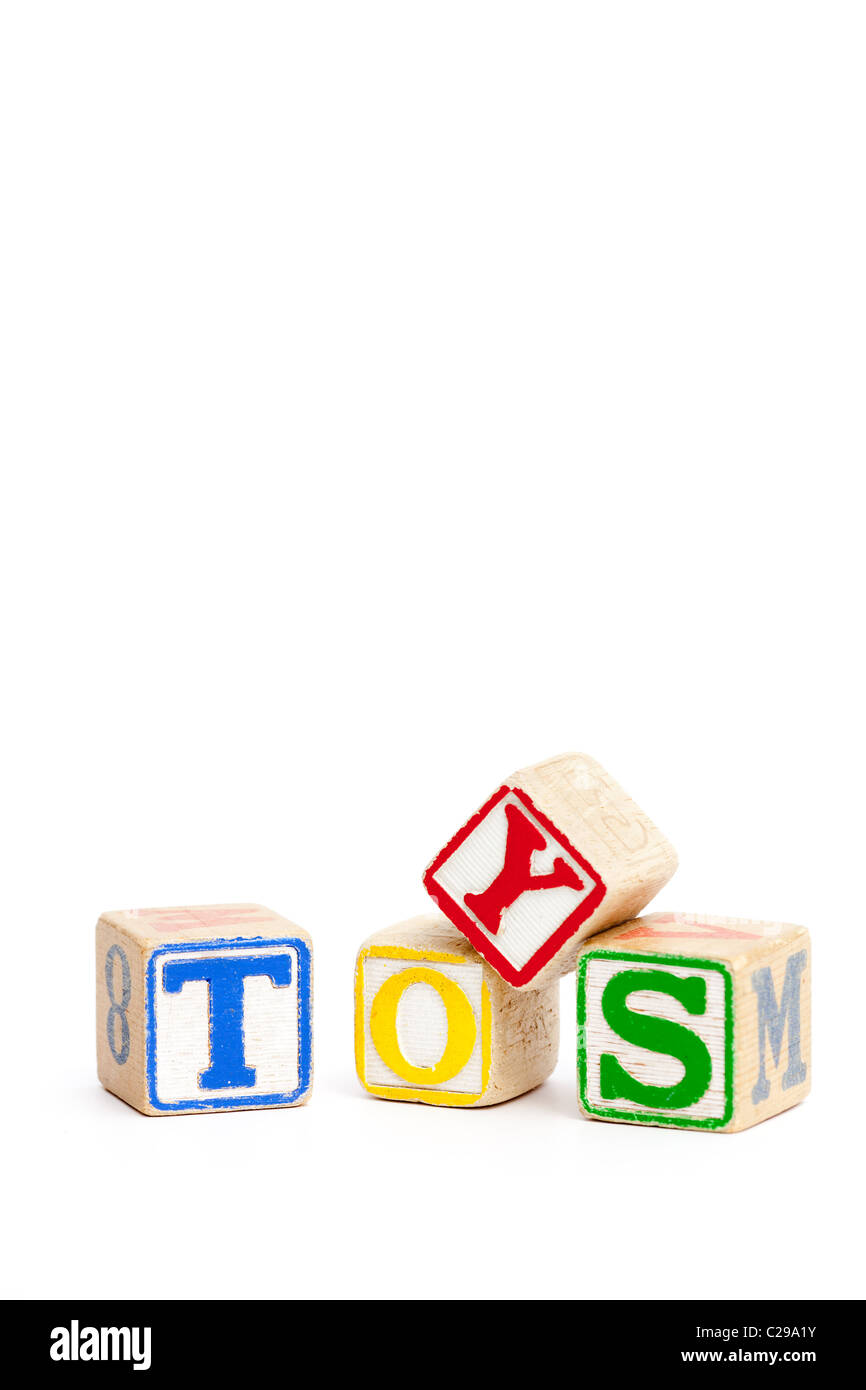 Toy blocks isolated on white spelling the word toys Stock Photo - Alamy