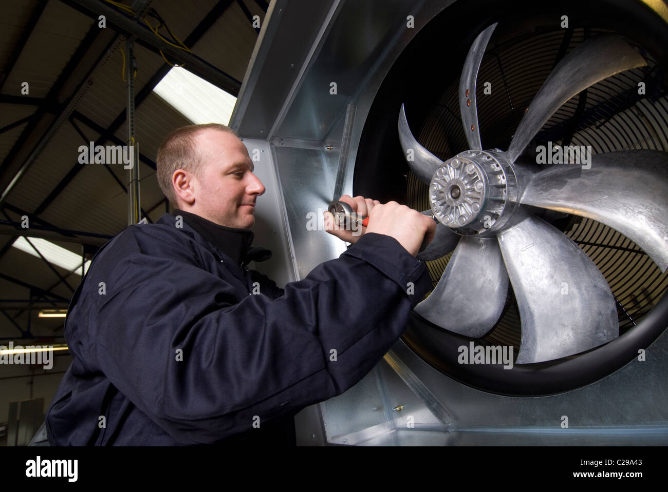 Engineer working on an industrial extractor fan Stock Photo - Alamy