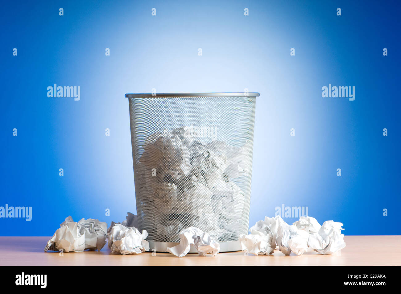 Garbage bin with paper waste isolated on white Stock Photo - Alamy
