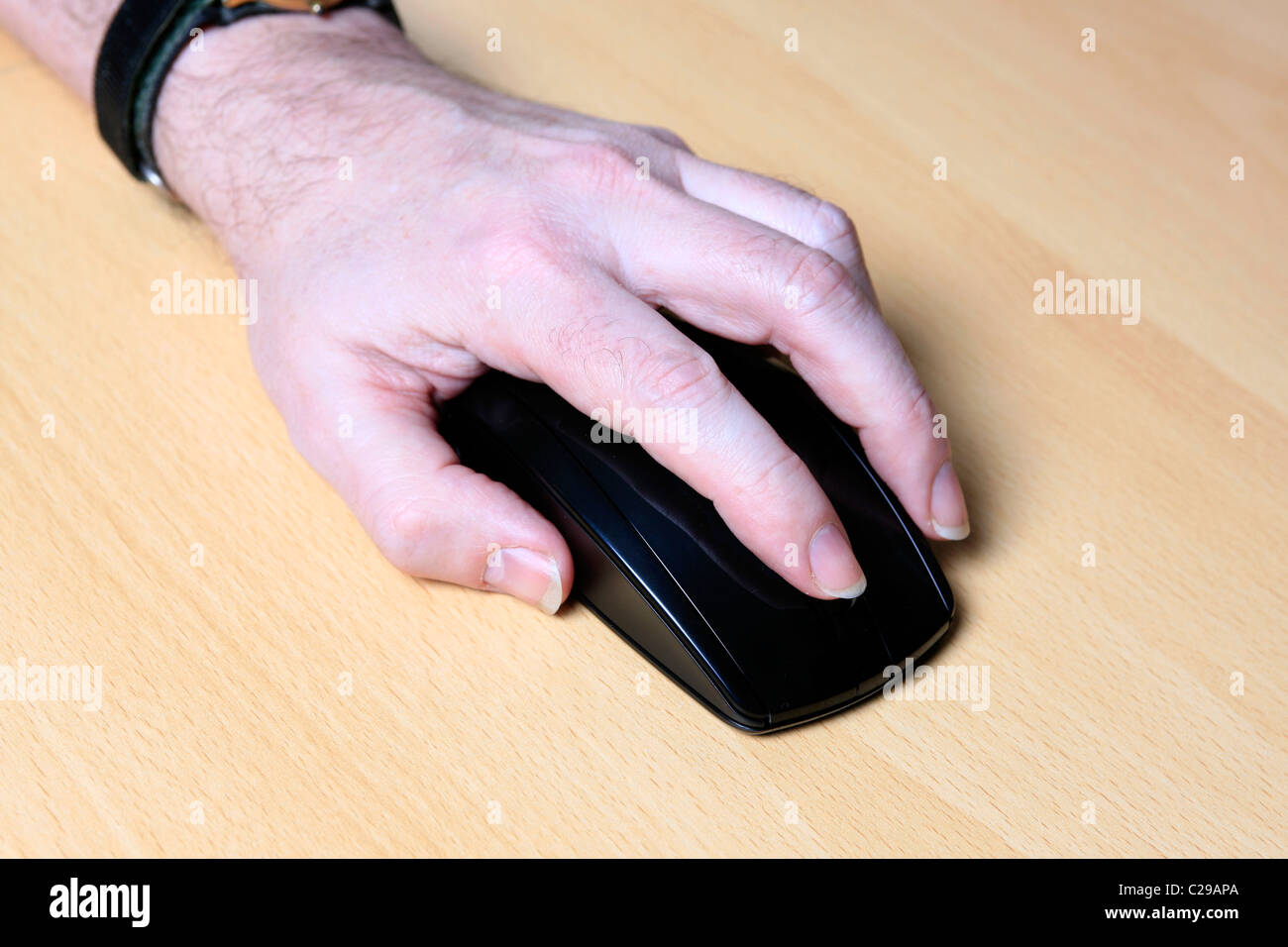 Hand using a modern WiFi cordless computer Mouse Stock Photo - Alamy