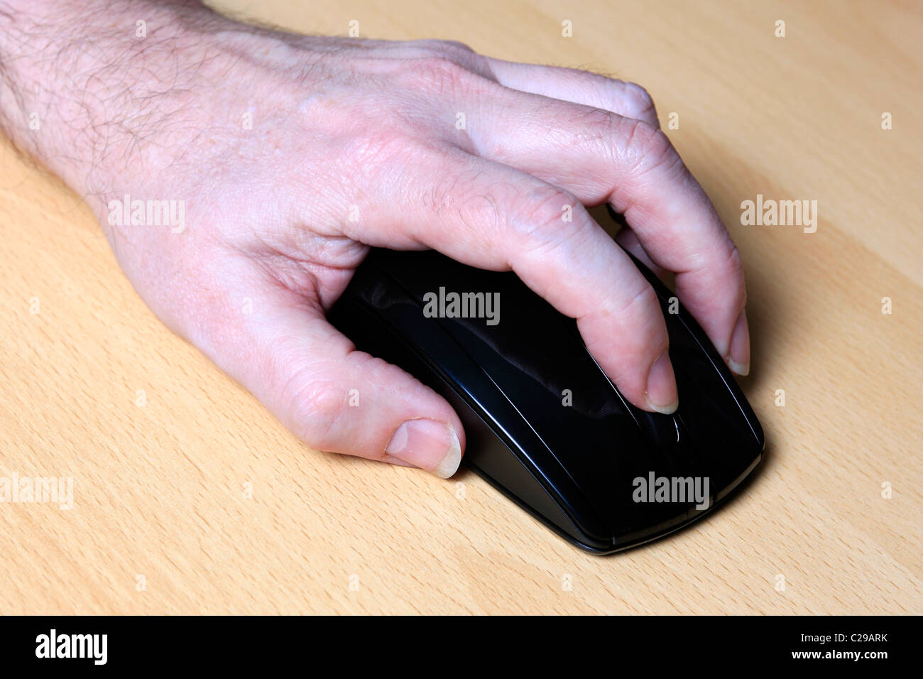 Hand using a modern WiFi cordless computer Mouse Stock Photo - Alamy