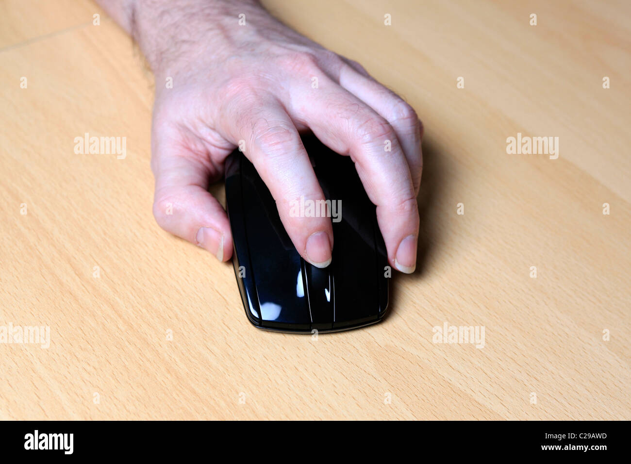 Hand using a modern WiFi cordless computer Mouse Stock Photo - Alamy