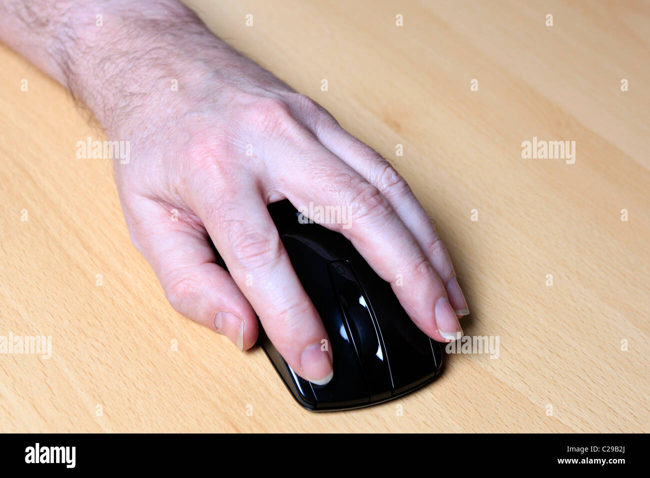 Hand using a modern WiFi cordless computer Mouse Stock Photo - Alamy