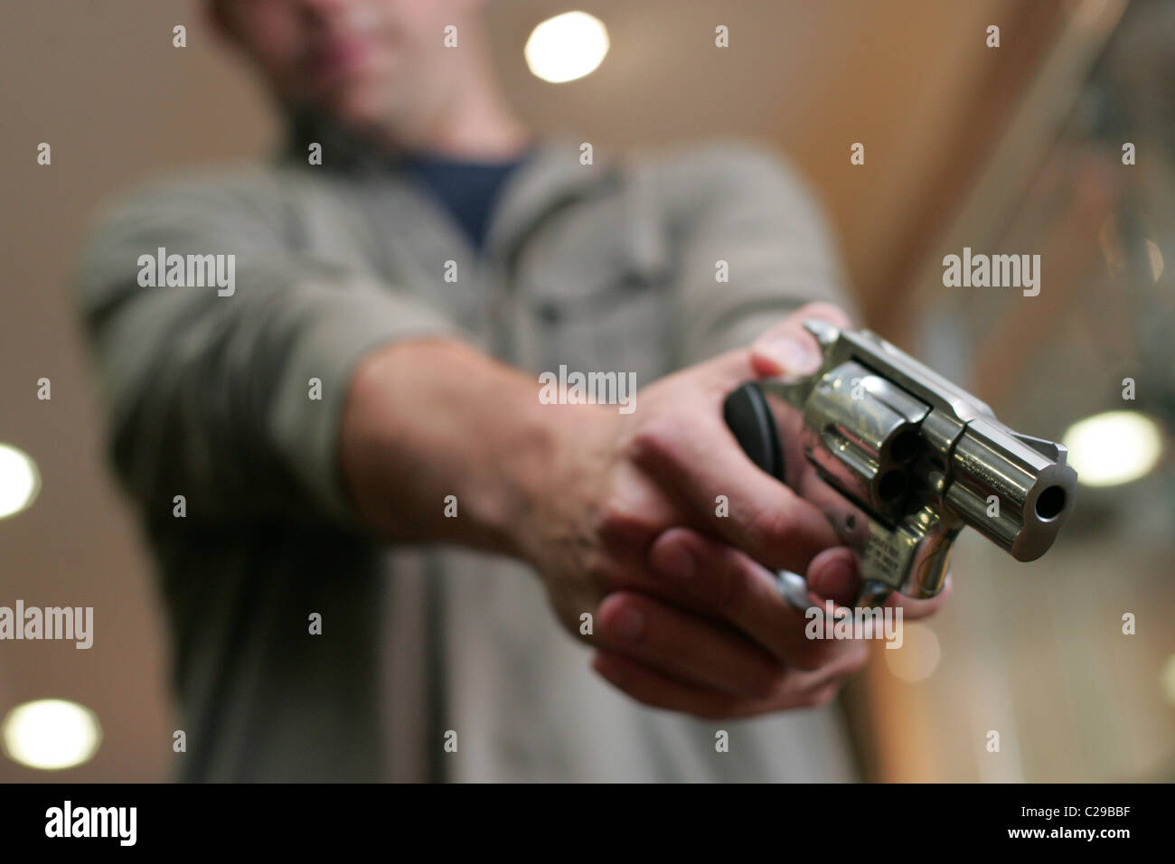 Man pointing handgun Stock Photo - Alamy